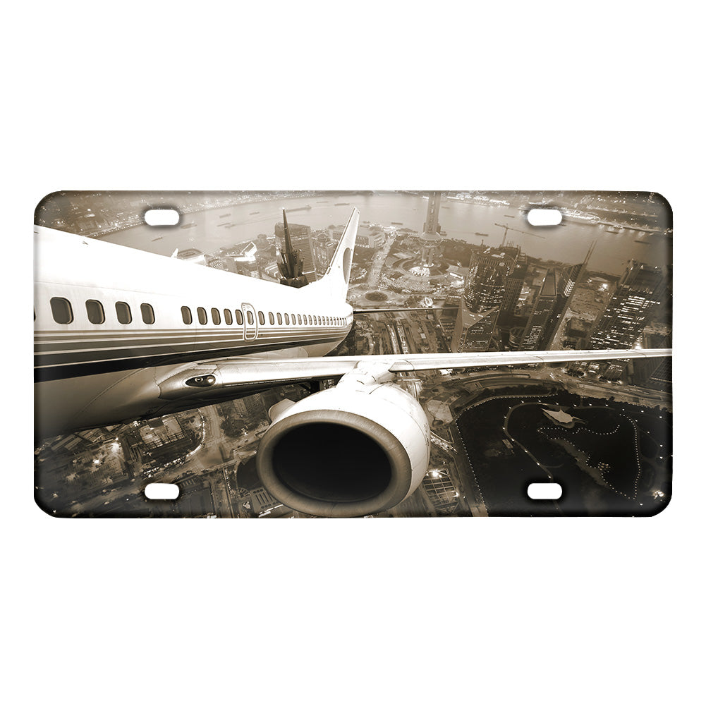Departing Aircraft & City Scene behind Designed Metal (License) Plates ...
